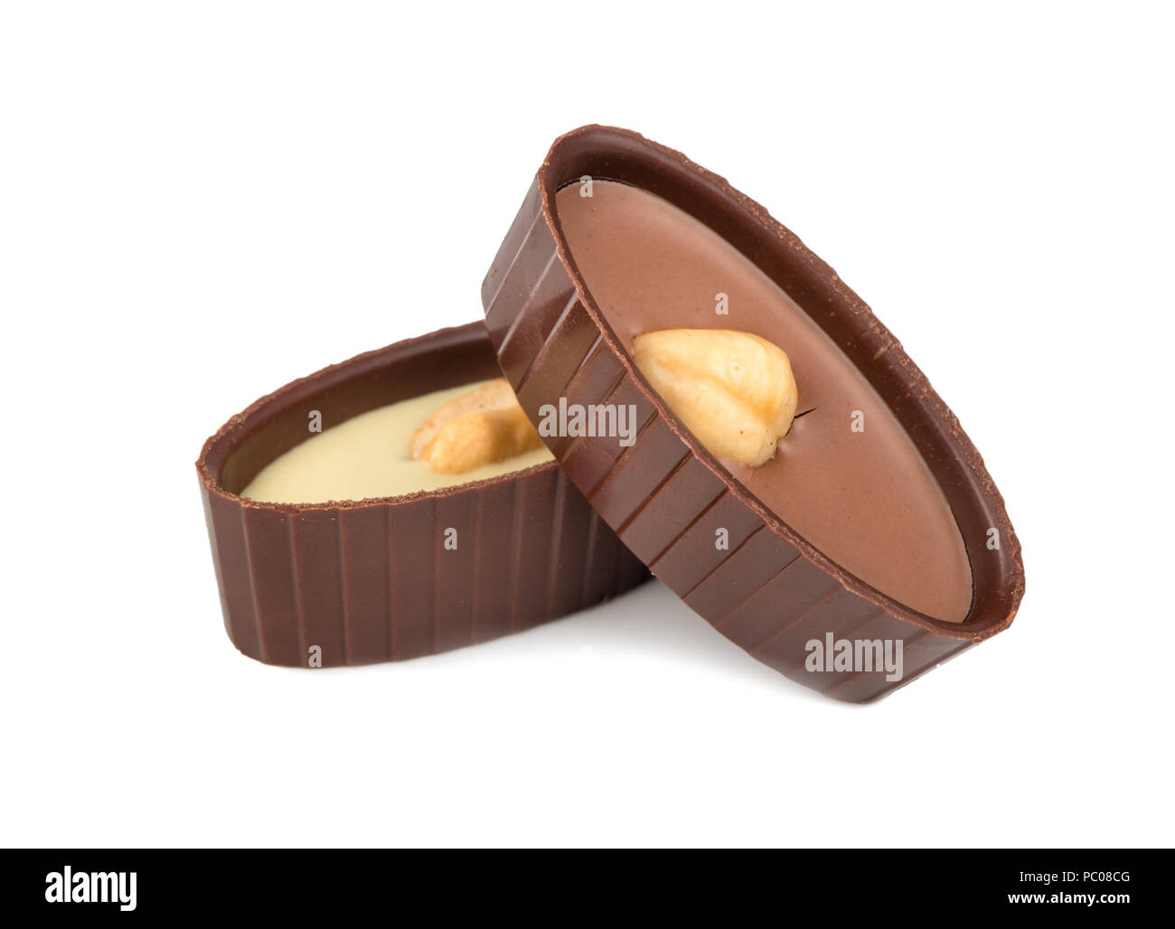 Two chocolates with nuts on white background Stock Photo - Alamy
