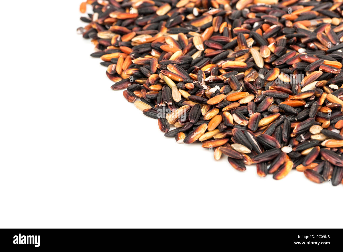Scattered raw wild rice on white background Stock Photo - Alamy