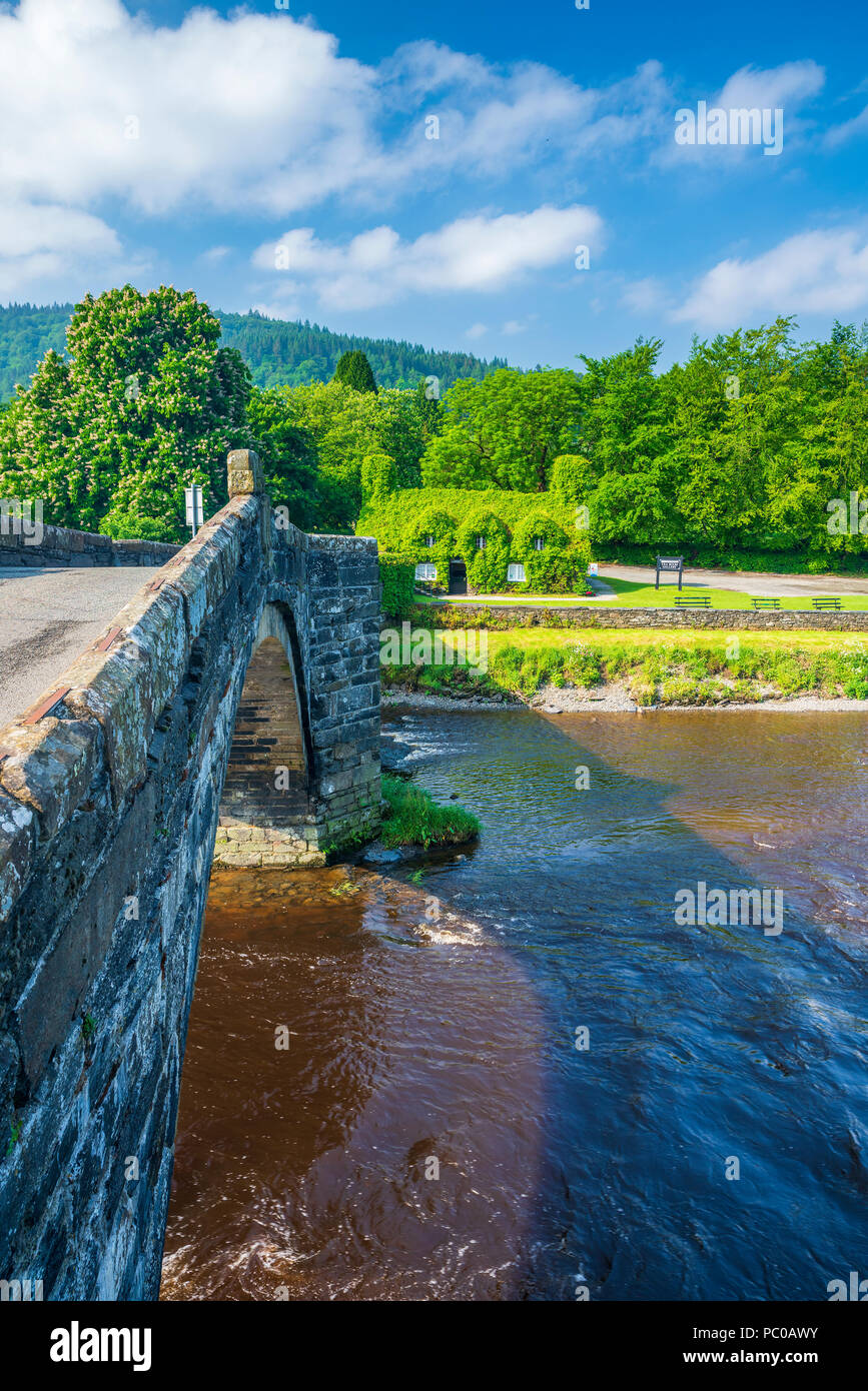 17th century stone bridge over the River Conwy at Llanrwst, with the ...