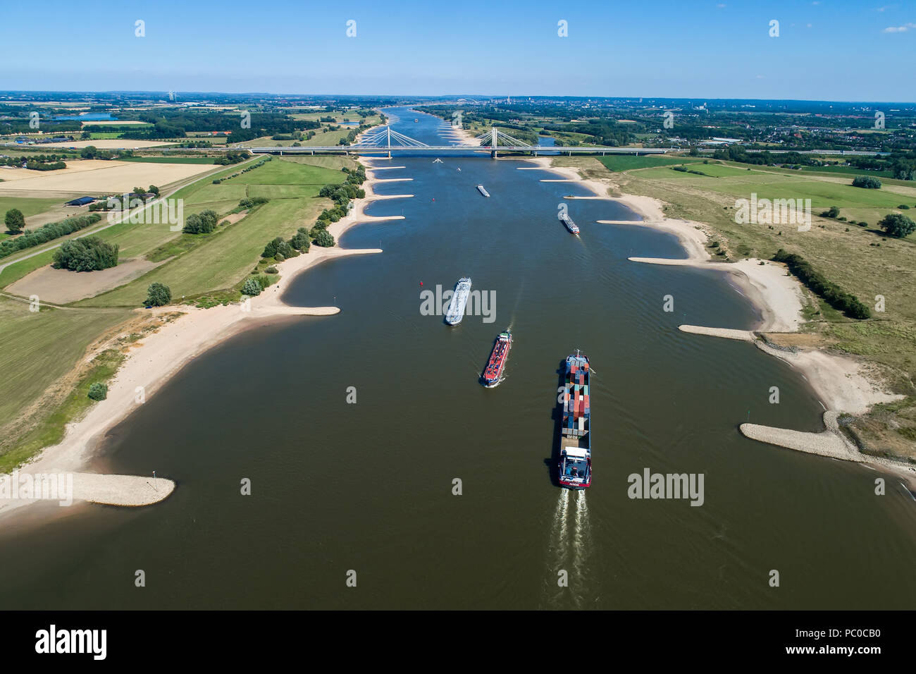 Rhine - Netherlands, July 14, 2018: aerial view of a merchant ship with ...