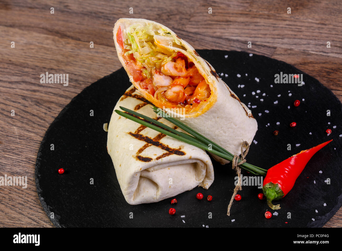 Chicken roll with tortilla served pepper Stock Photo - Alamy