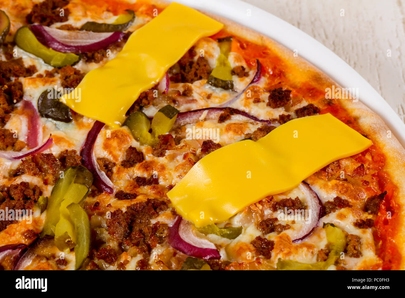 Pizza with minced meat and cheese Stock Photo - Alamy