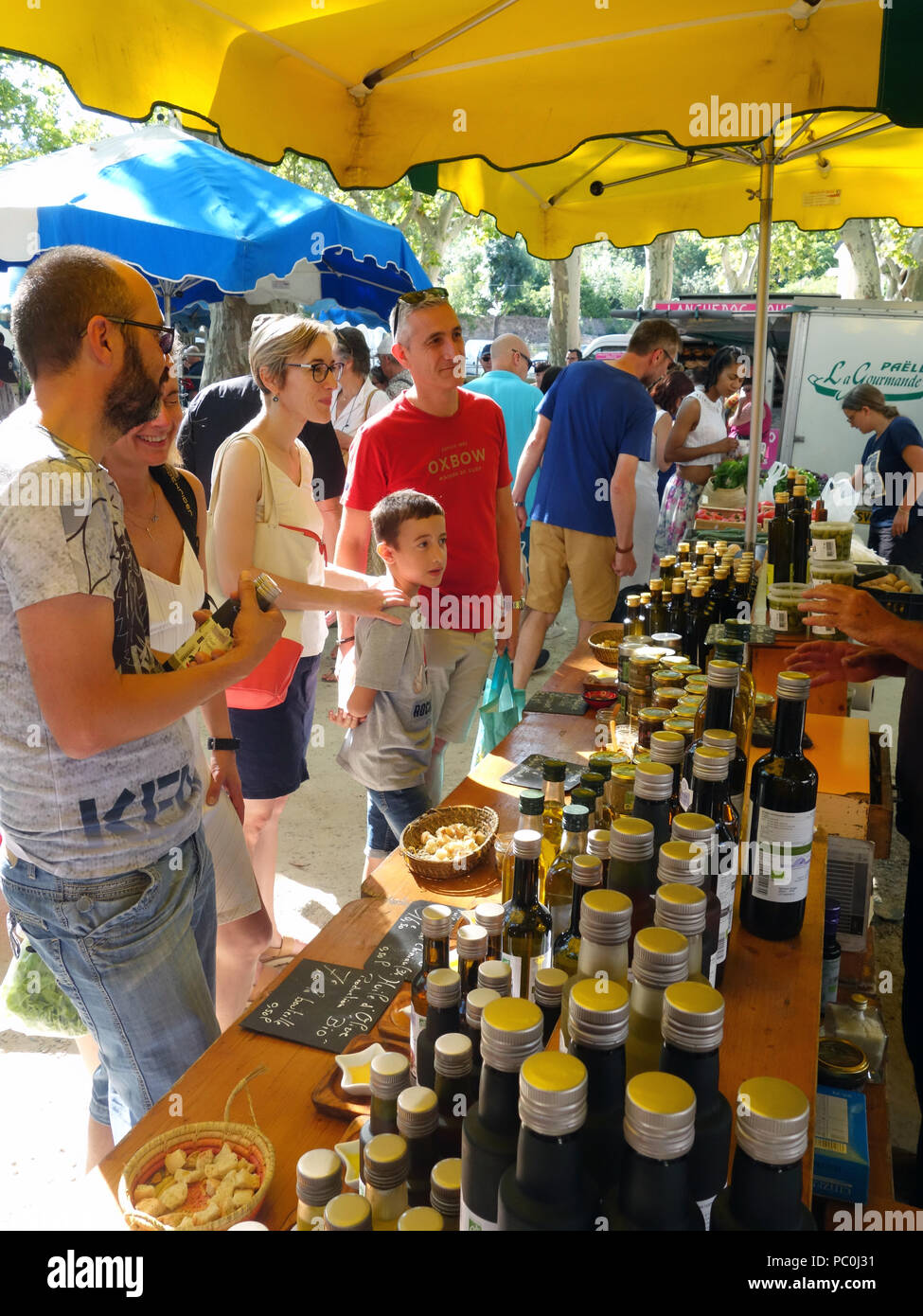 Colourful busy market at Saint Chinian french market Stock Photo - Alamy