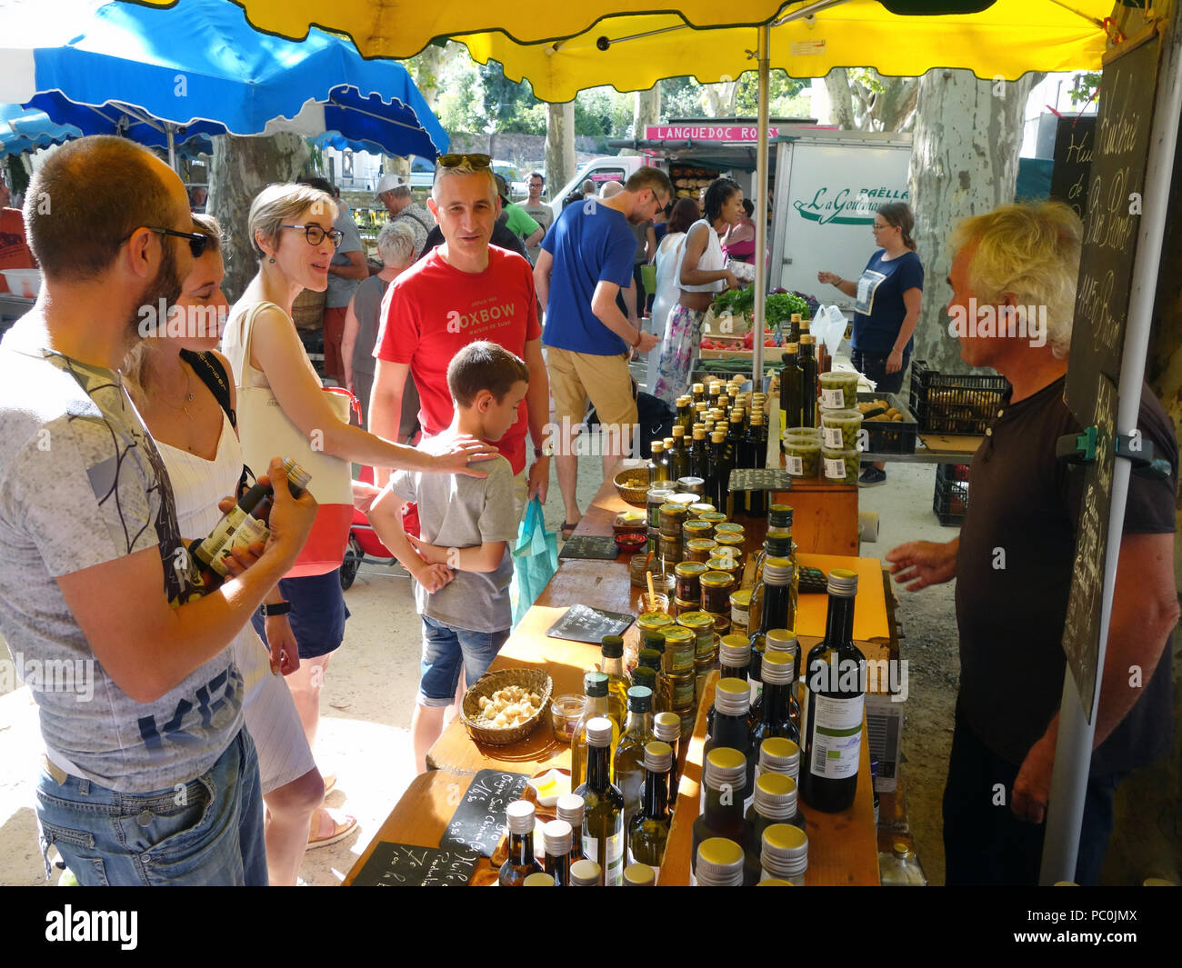 Colourful busy market at Saint Chinian french market Stock Photo - Alamy