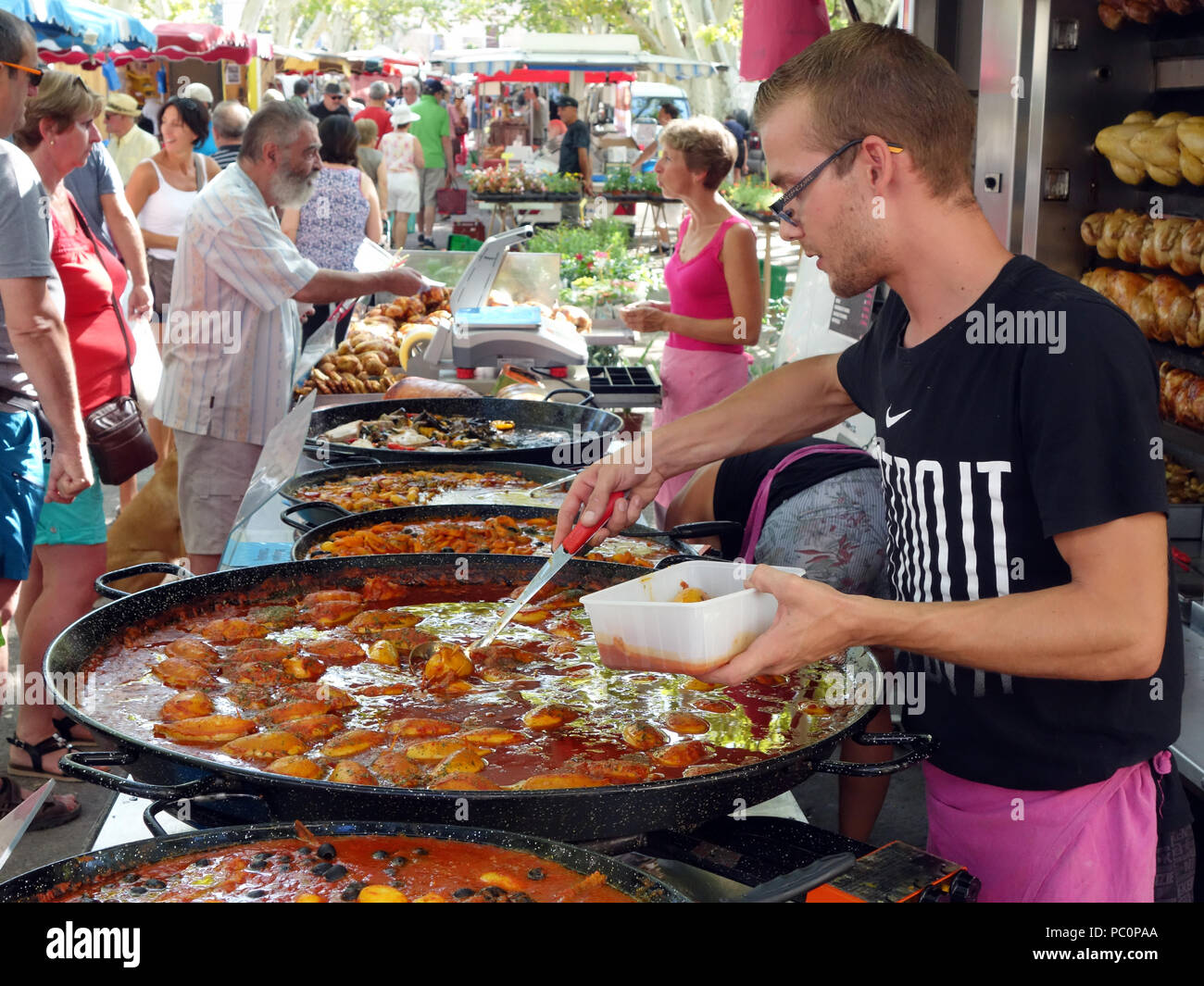 Colourful busy market at Saint Chinian french market Stock Photo - Alamy