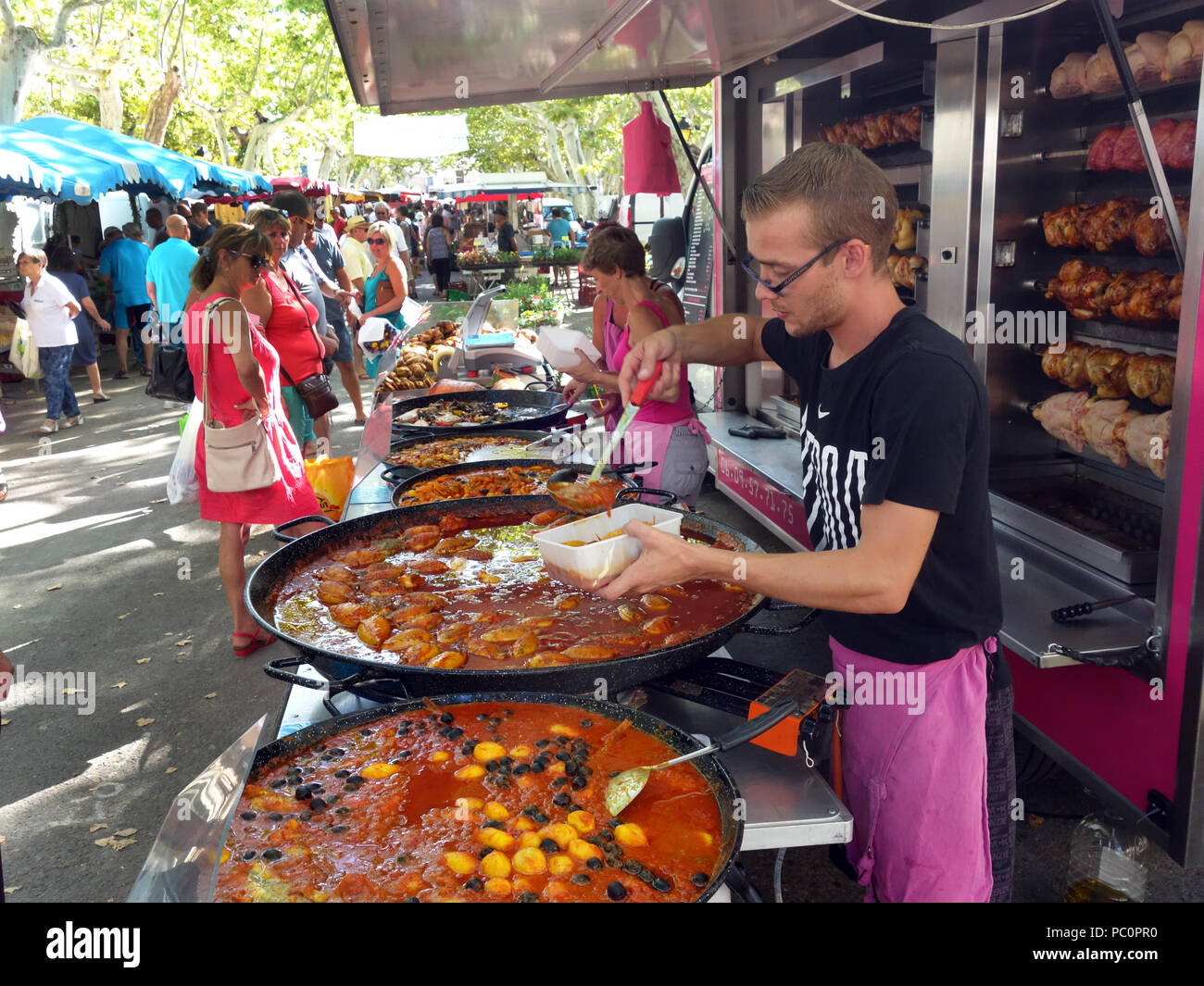 Colourful busy market at Saint Chinian french market Stock Photo - Alamy