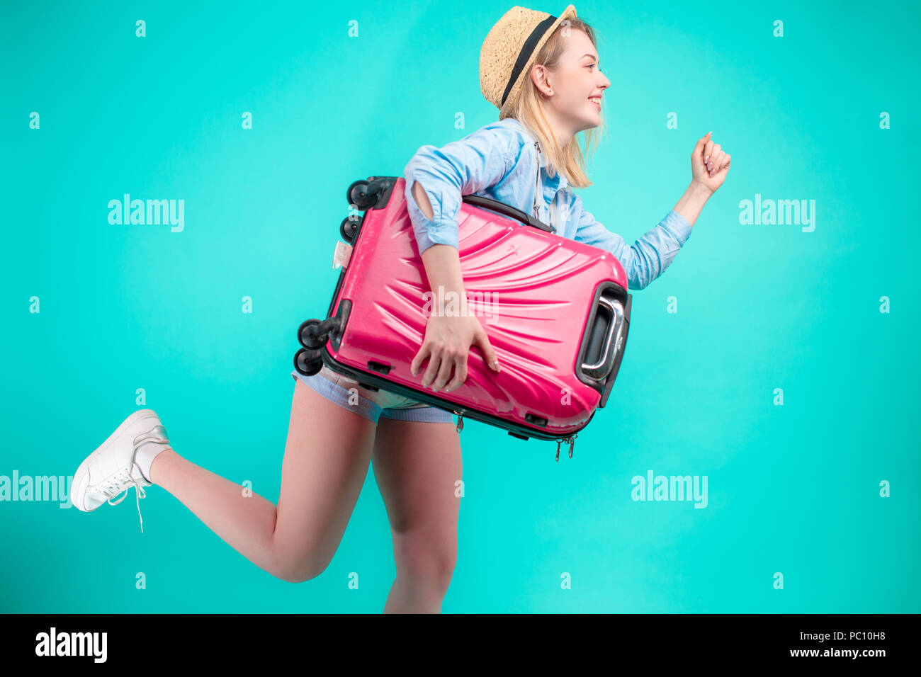 Travel concept. Full length studio portrait of beautiful tourist ...