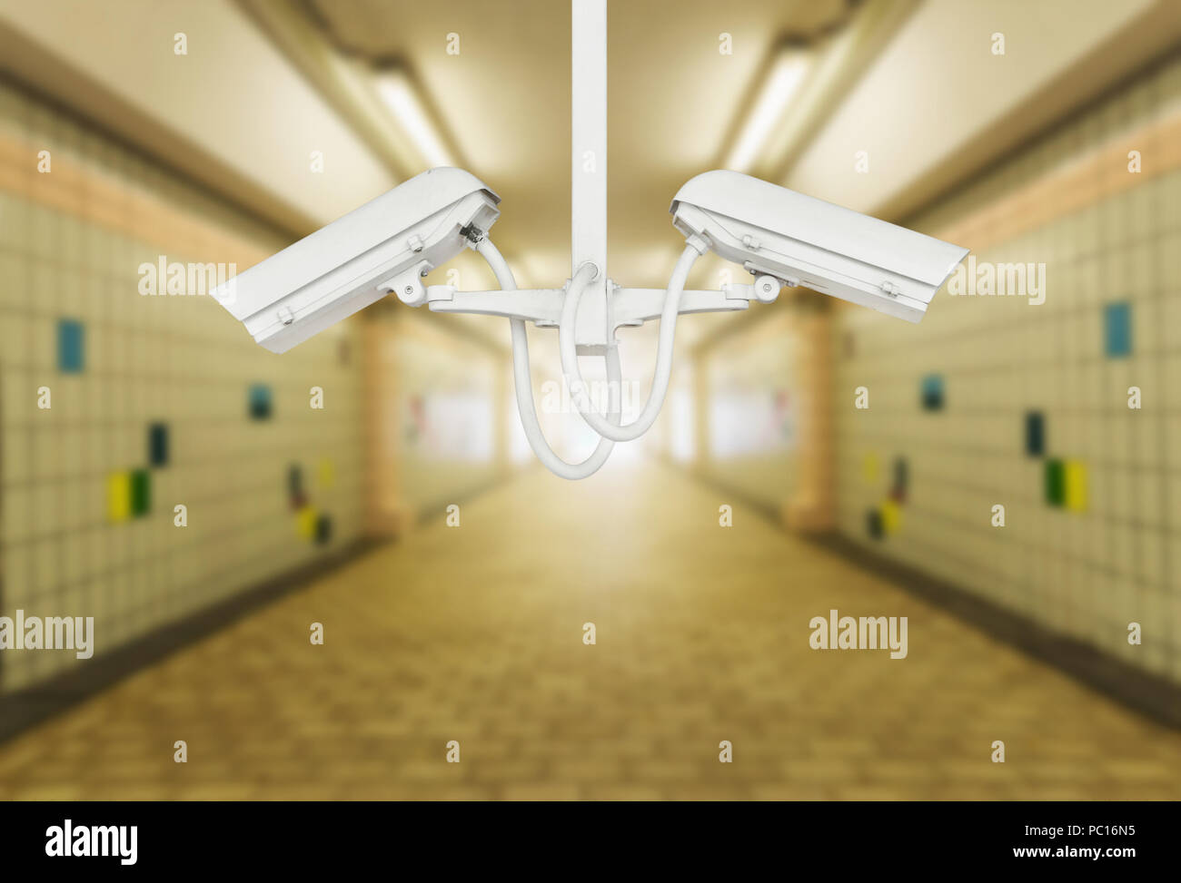 security camera surveillance (CCTV) on tunnel walk way path Stock Photo ...