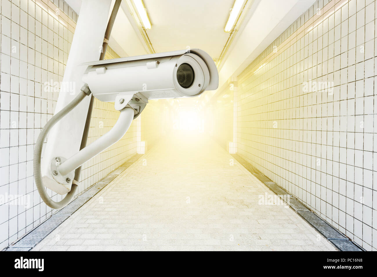security camera surveillance (CCTV) on tunnel walk way path Stock Photo ...