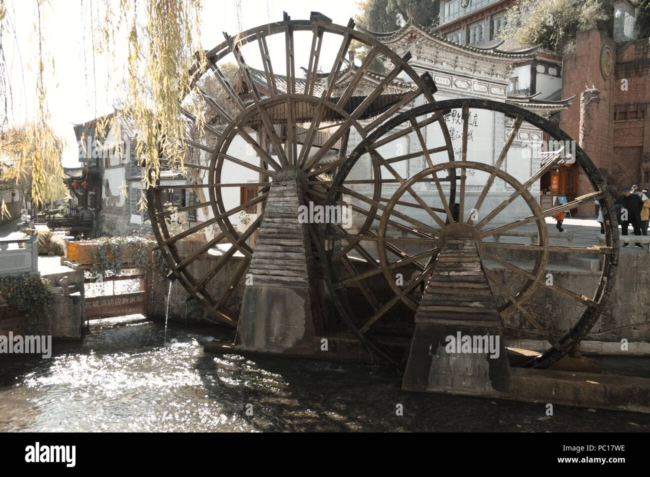 Old chinese water mill in the entrance of the Old Town of Lijiang ...
