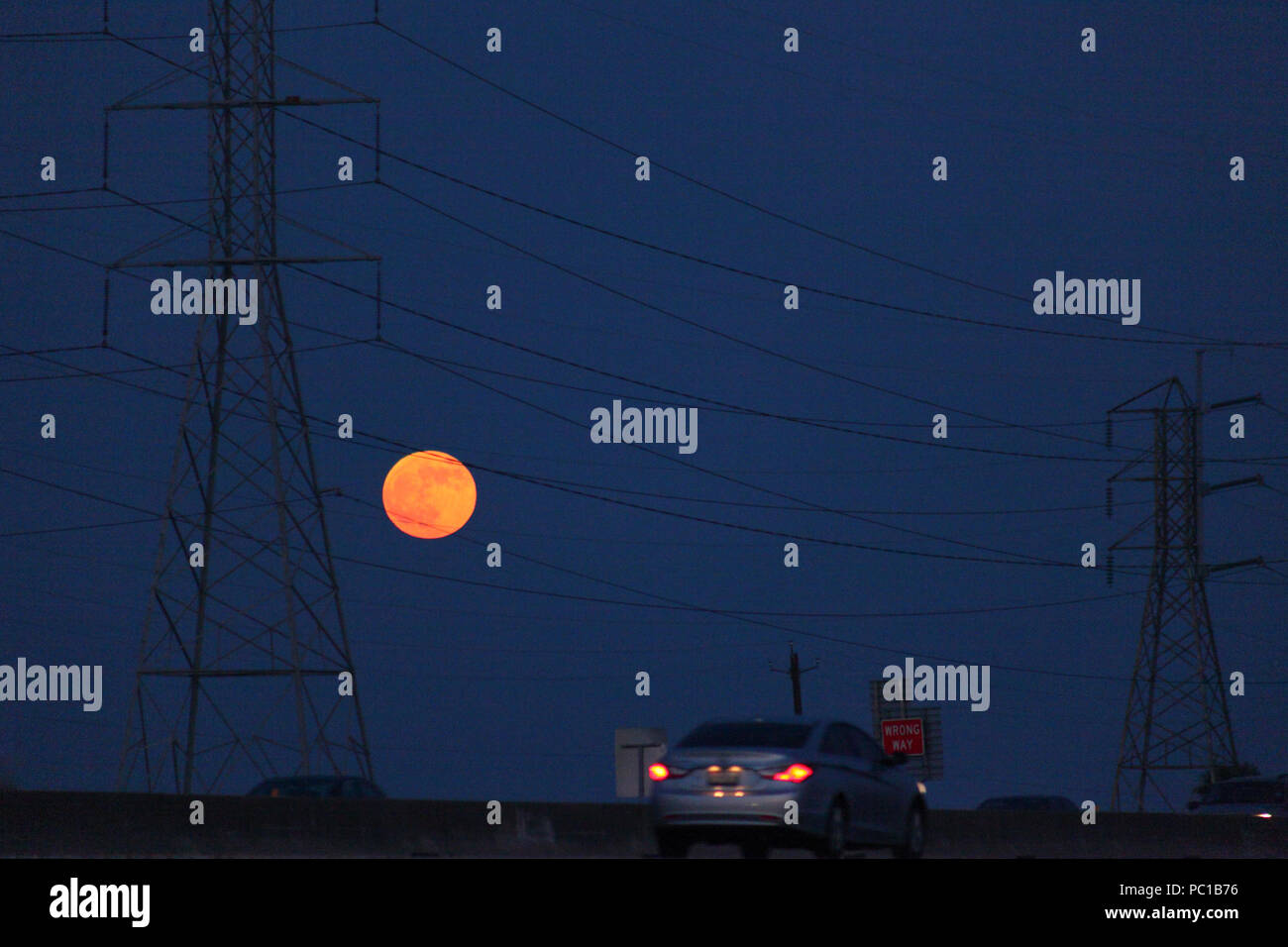Moonrise over highway in Texas Stock Photo - Alamy