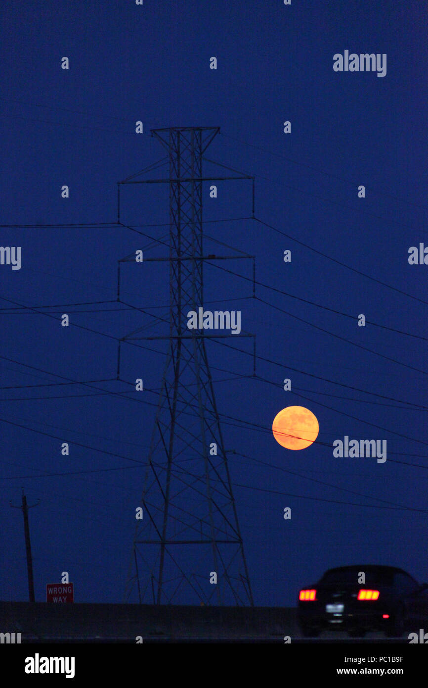 Moonrise over highway in Texas Stock Photo - Alamy