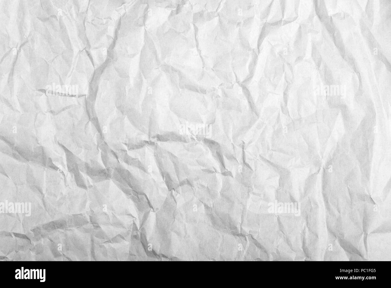highly crumpled gray paper sheet with dents Close up Stock Photo - Alamy
