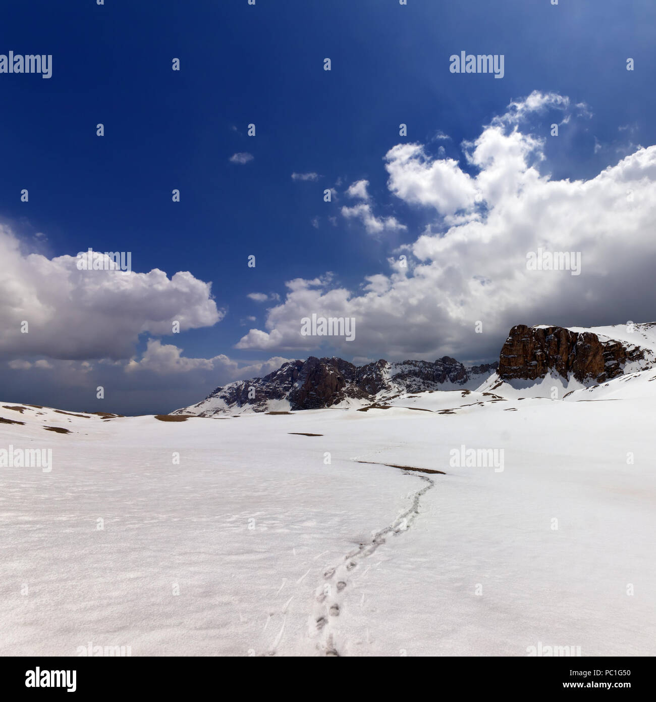 Snowy plateau with footpath at sunlight cloudy sky. Turkey, Central ...