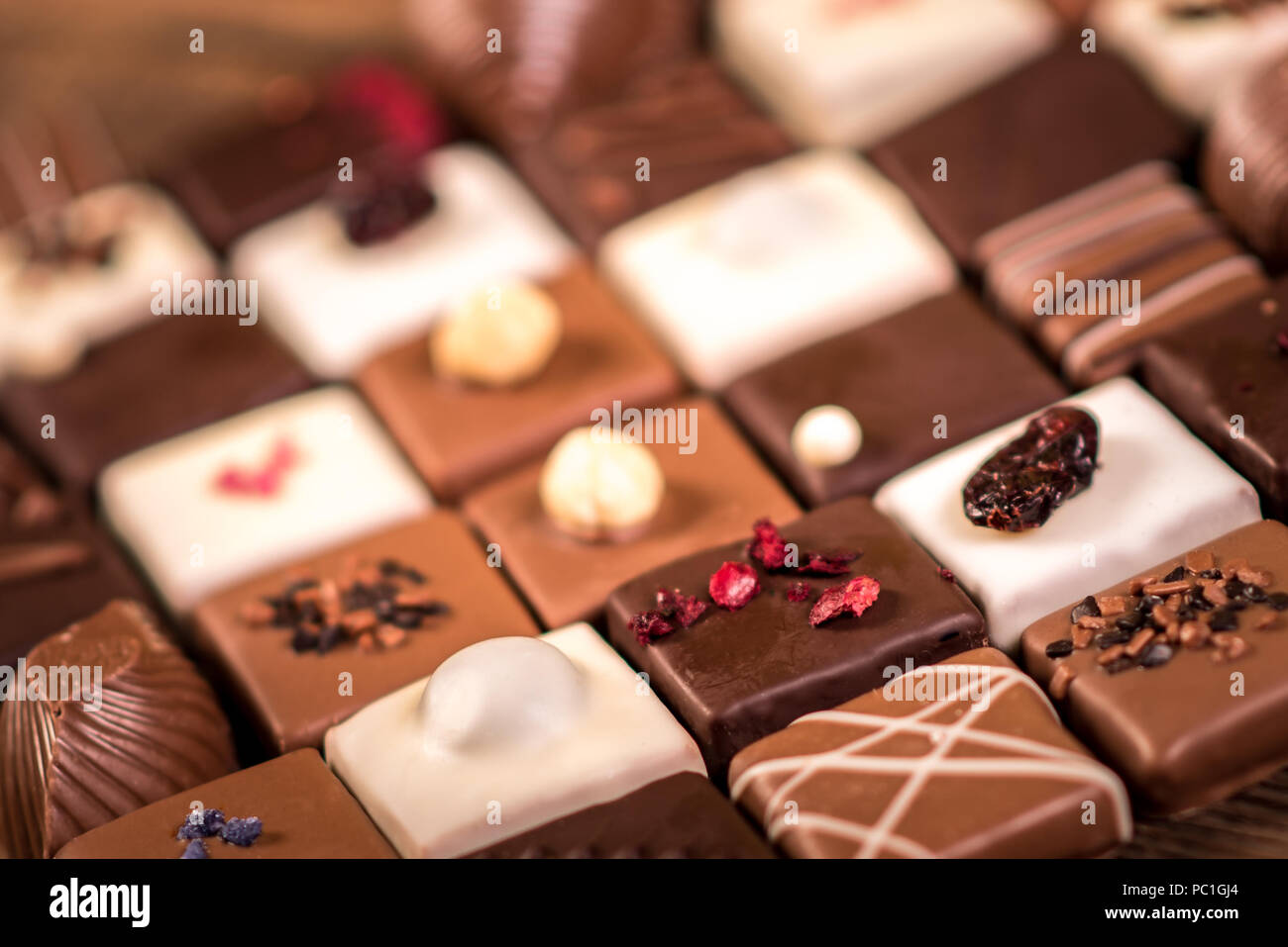 Assortment of fine chocolate candies, white, dark and milk chocolate ...