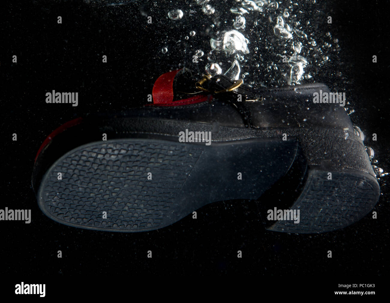 Drowning shoe - sinking. Boots in the water, drowning Stock Photo - Alamy