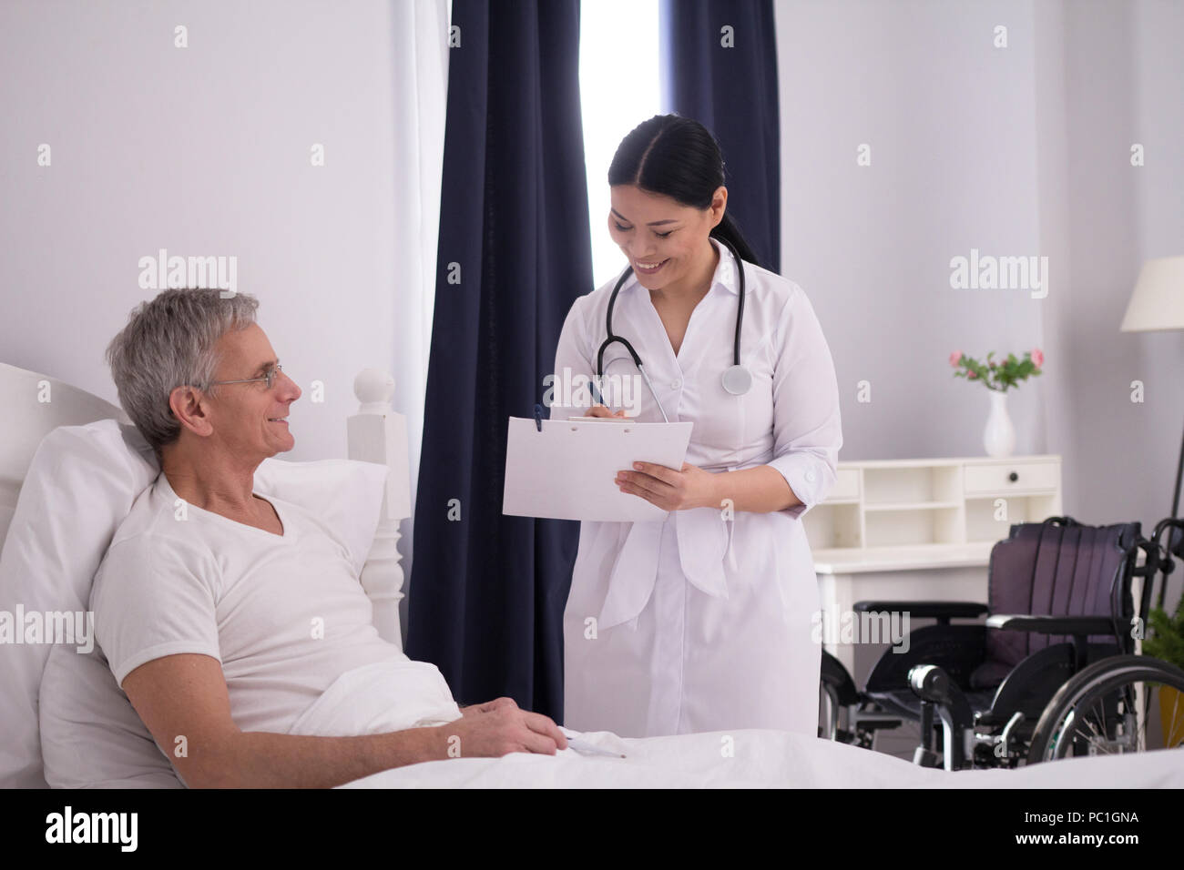 Woman lying in bed checking hi-res stock photography and images - Alamy