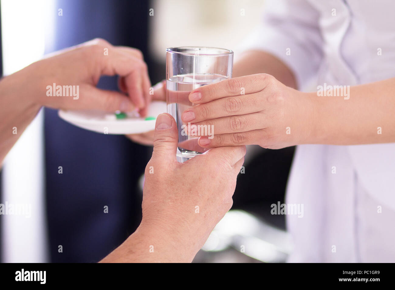 Nurse giving medication Stock Photo - Alamy