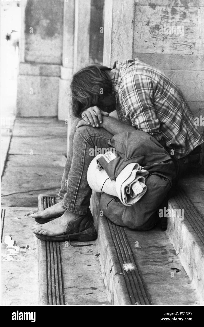 Washington DC, USA, 1982. Candid picture of a man smoking a cigar while ...