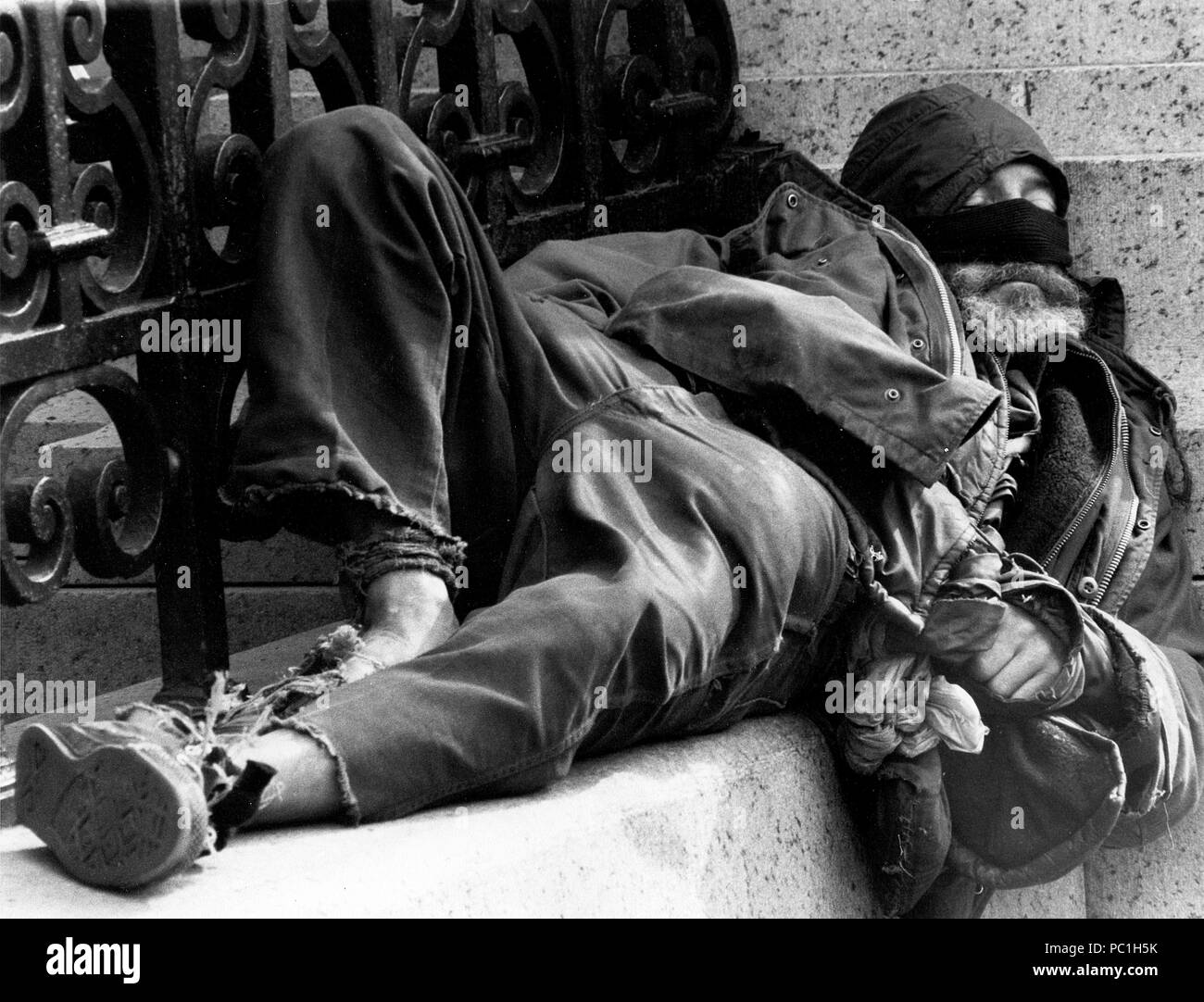 U.S.A., approx. 1984. Homeless man sleeping on the street Stock Photo ...