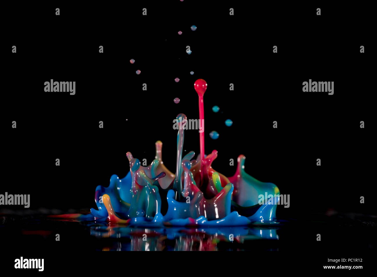 abstract color splash isolated on black background Stock Photo - Alamy