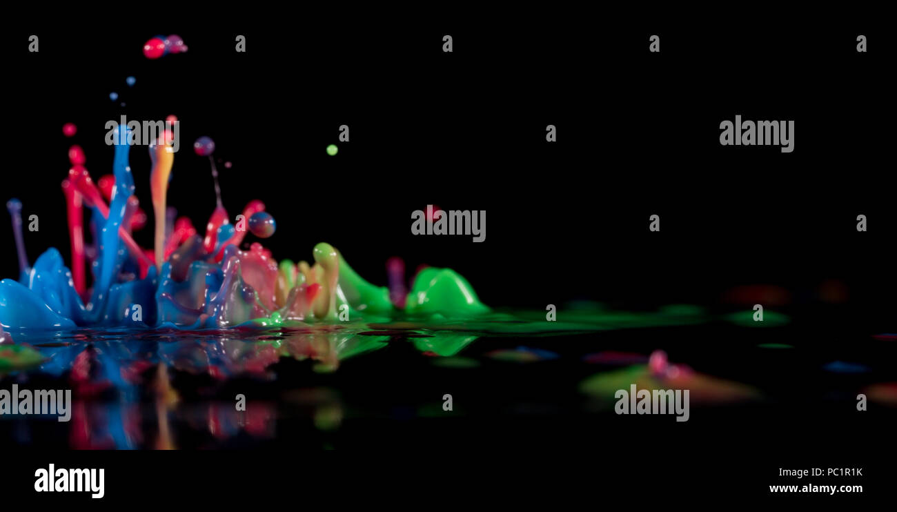 abstract color splash isolated on black background Stock Photo - Alamy