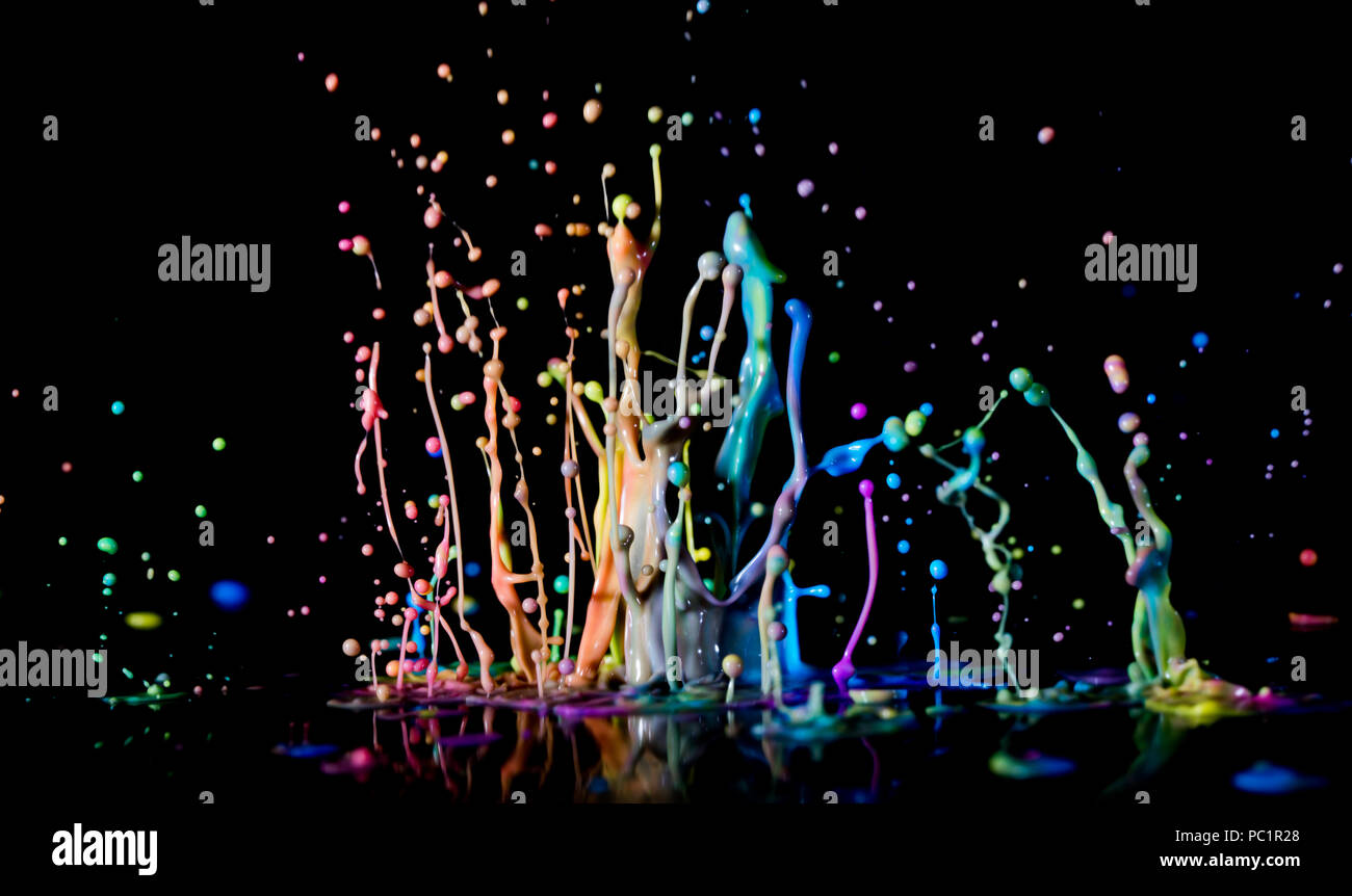 abstract color splash isolated on black background Stock Photo - Alamy