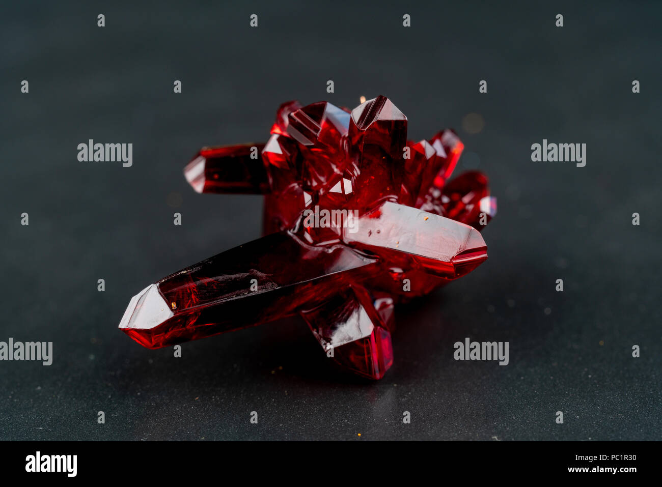 red crystal of natural origin. close up of crystals in ruby color on ...