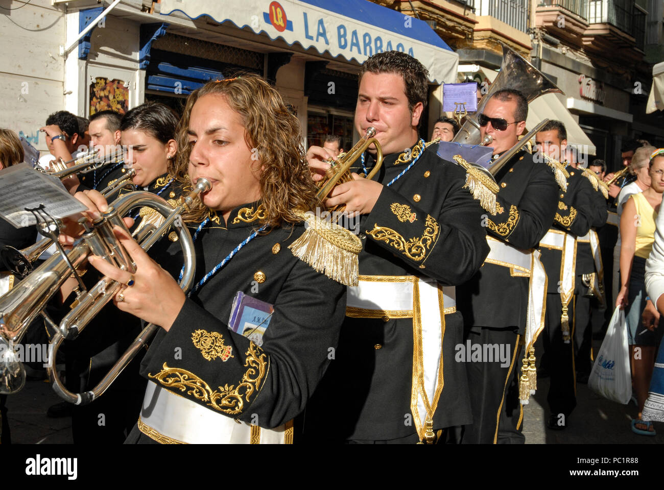 A band leading the Easter religious procession through the crowed ...