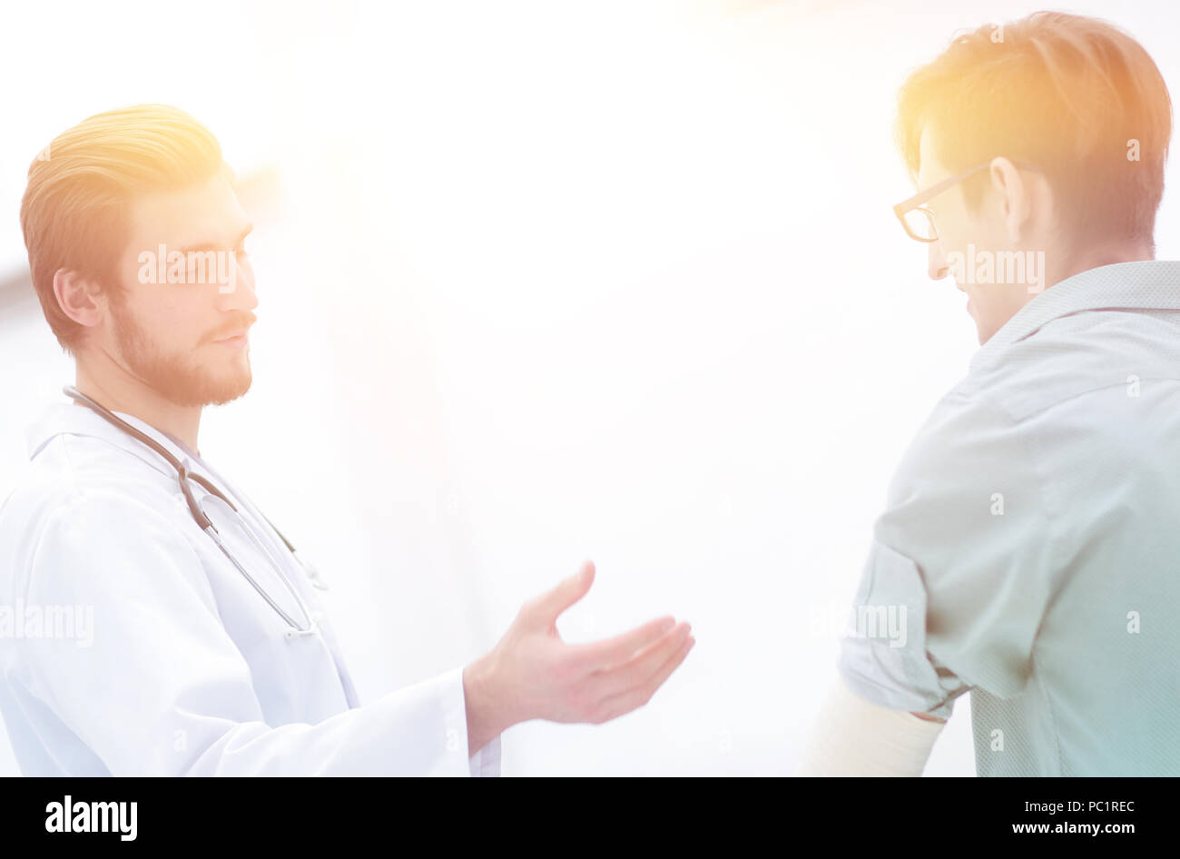 doctor explaining a patient Stock Photo - Alamy