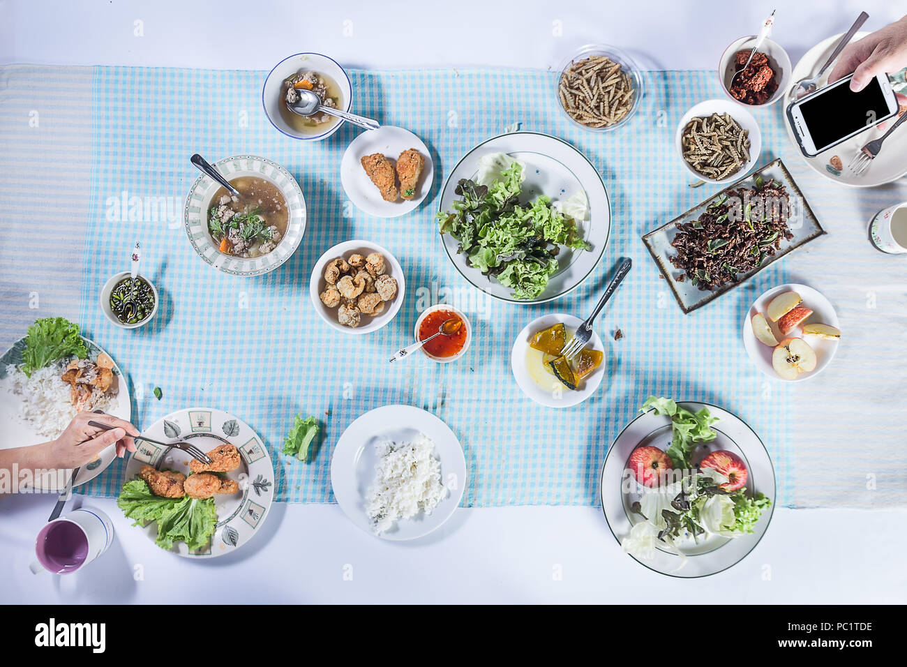 Top view of people eating food together Stock Photo - Alamy