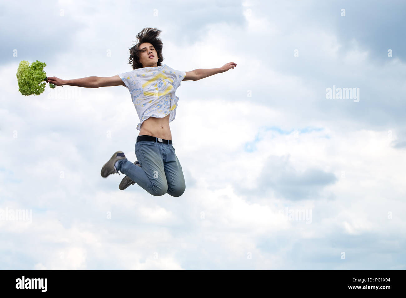jumping young guy Stock Photo - Alamy
