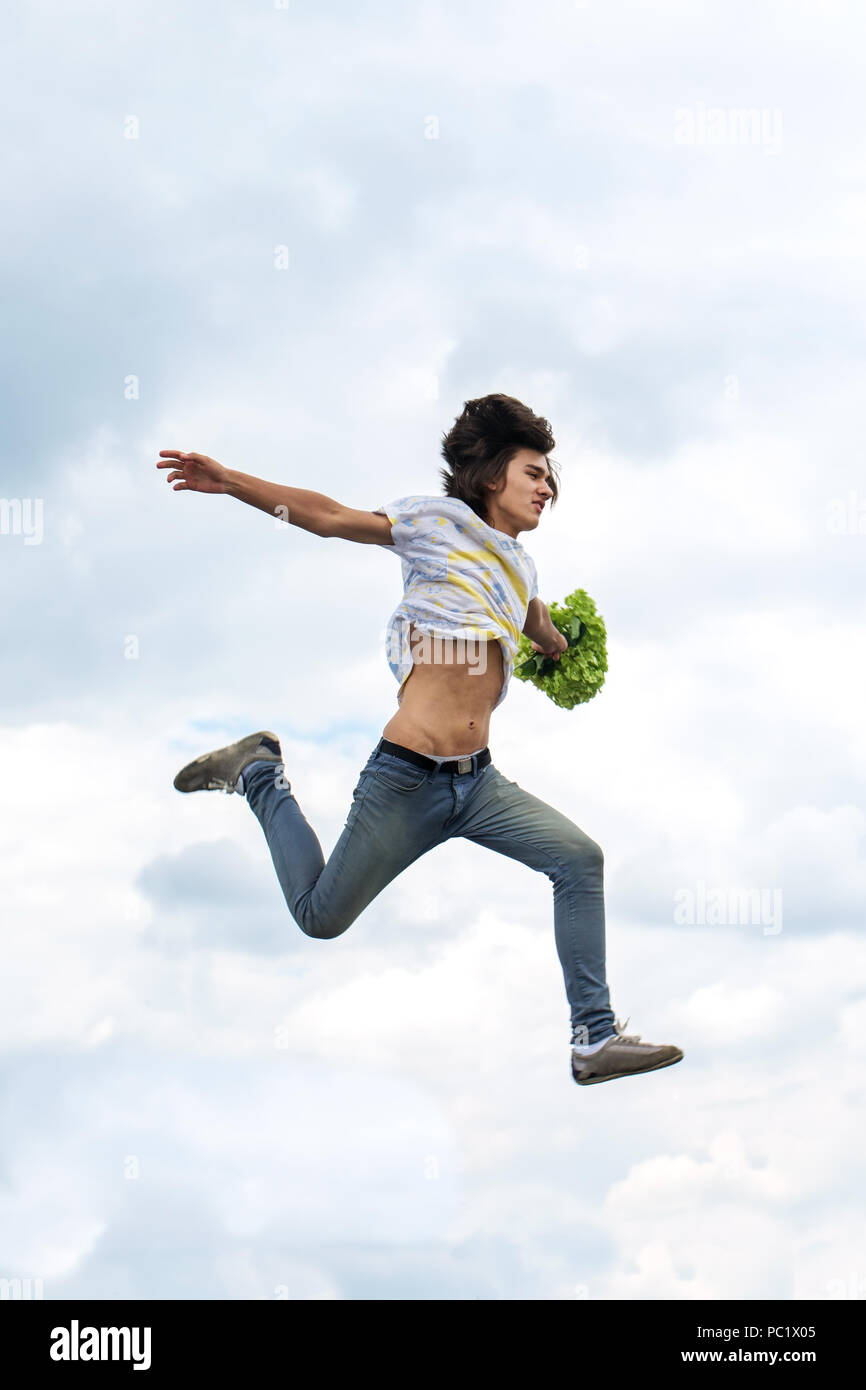 Portrait of a jumping young guy Stock Photo - Alamy
