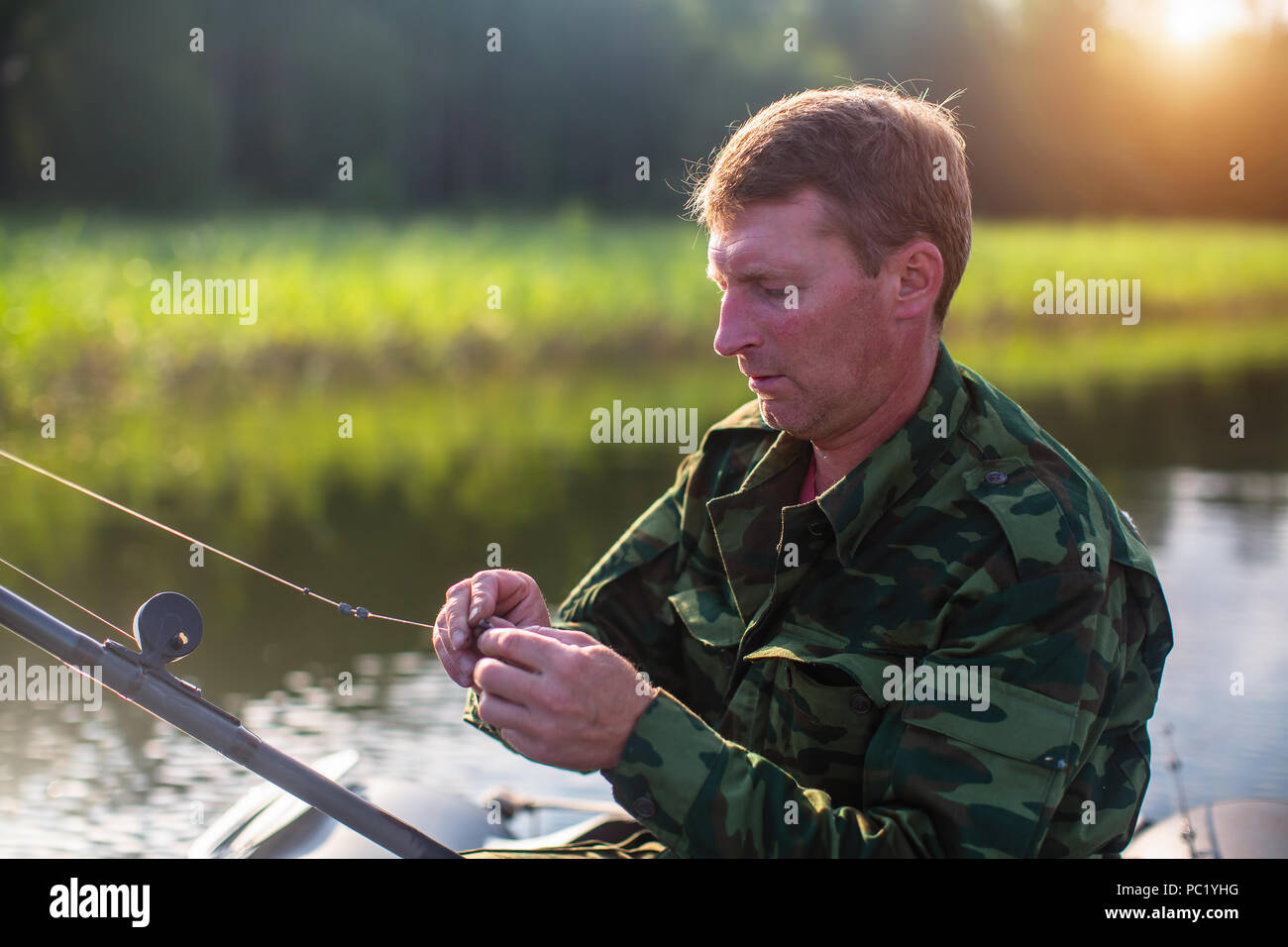 Fisherman catching big fish from boat hi-res stock photography and ...