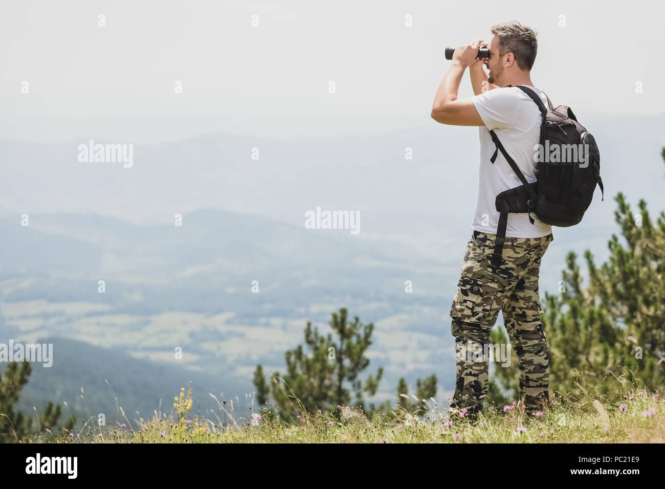 Man using binocular in mountain hi-res stock photography and images - Alamy
