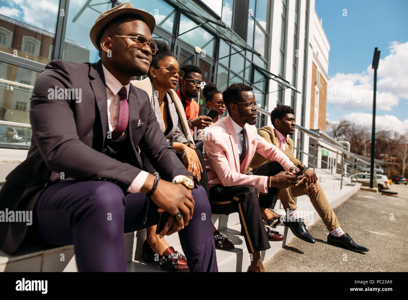 street african gang with pensive look. side view shot Stock Photo - Alamy