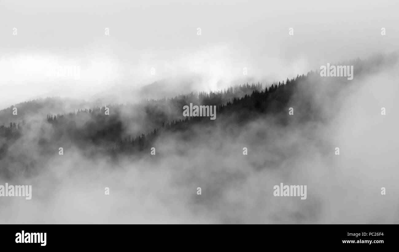 Dramatic clouds mountain background Black and White Stock Photos ...