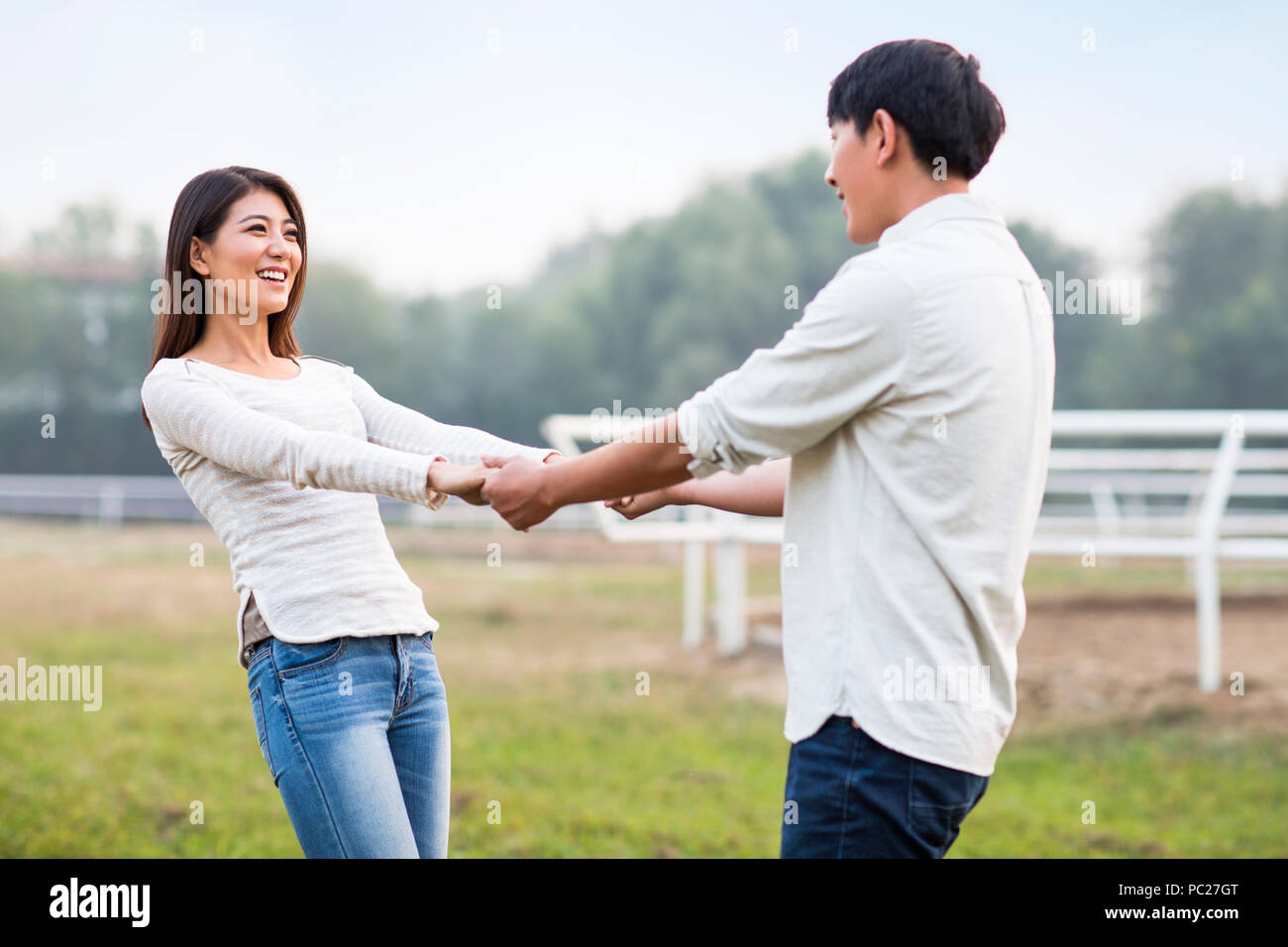 Cheerful young Chinese couple Stock Photo - Alamy Cheerful young Chinese couple Stock Photo - Alamy