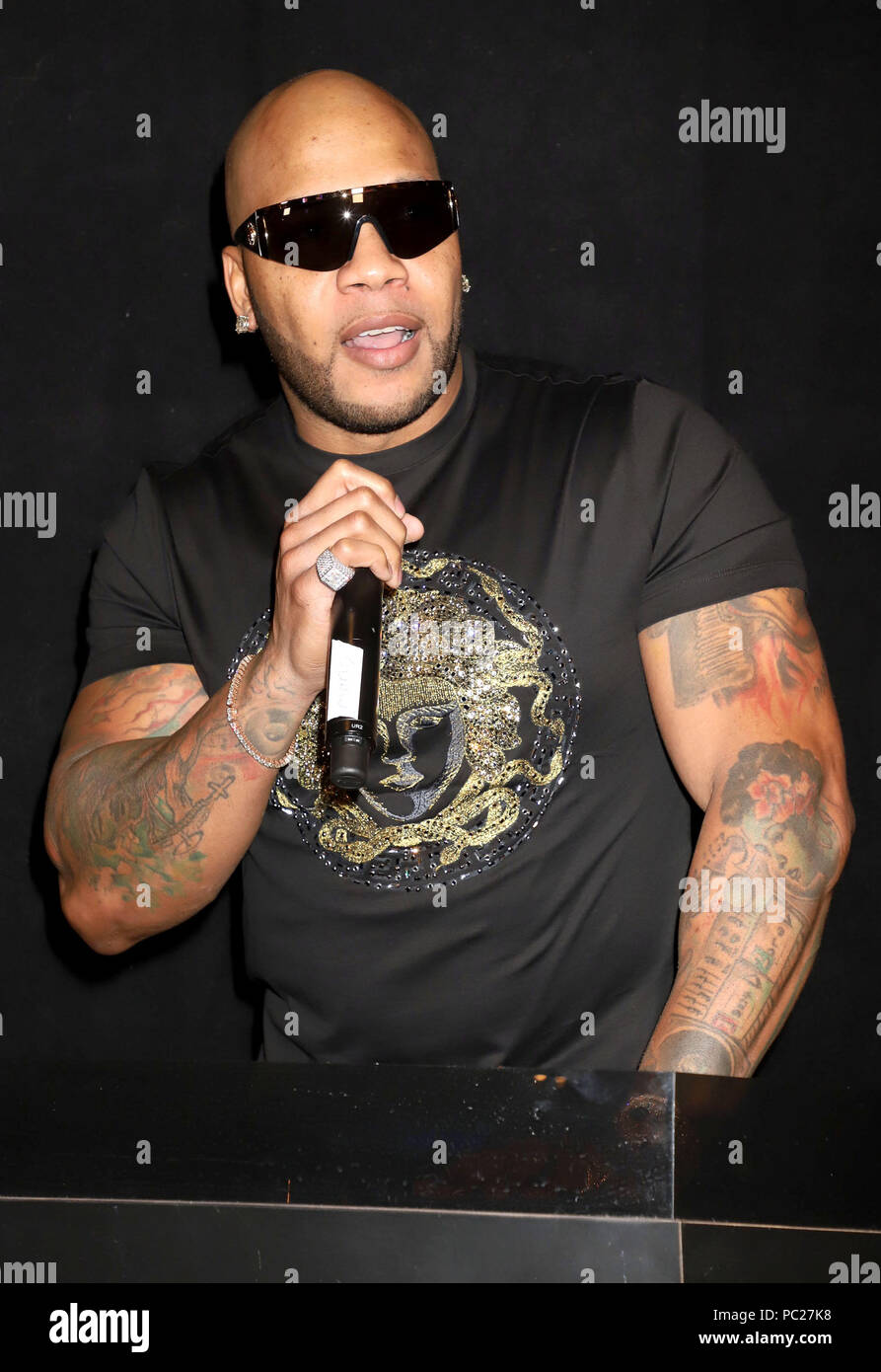Performer Flo Rida unveils personalized memorabilia case at Hard Rock ...