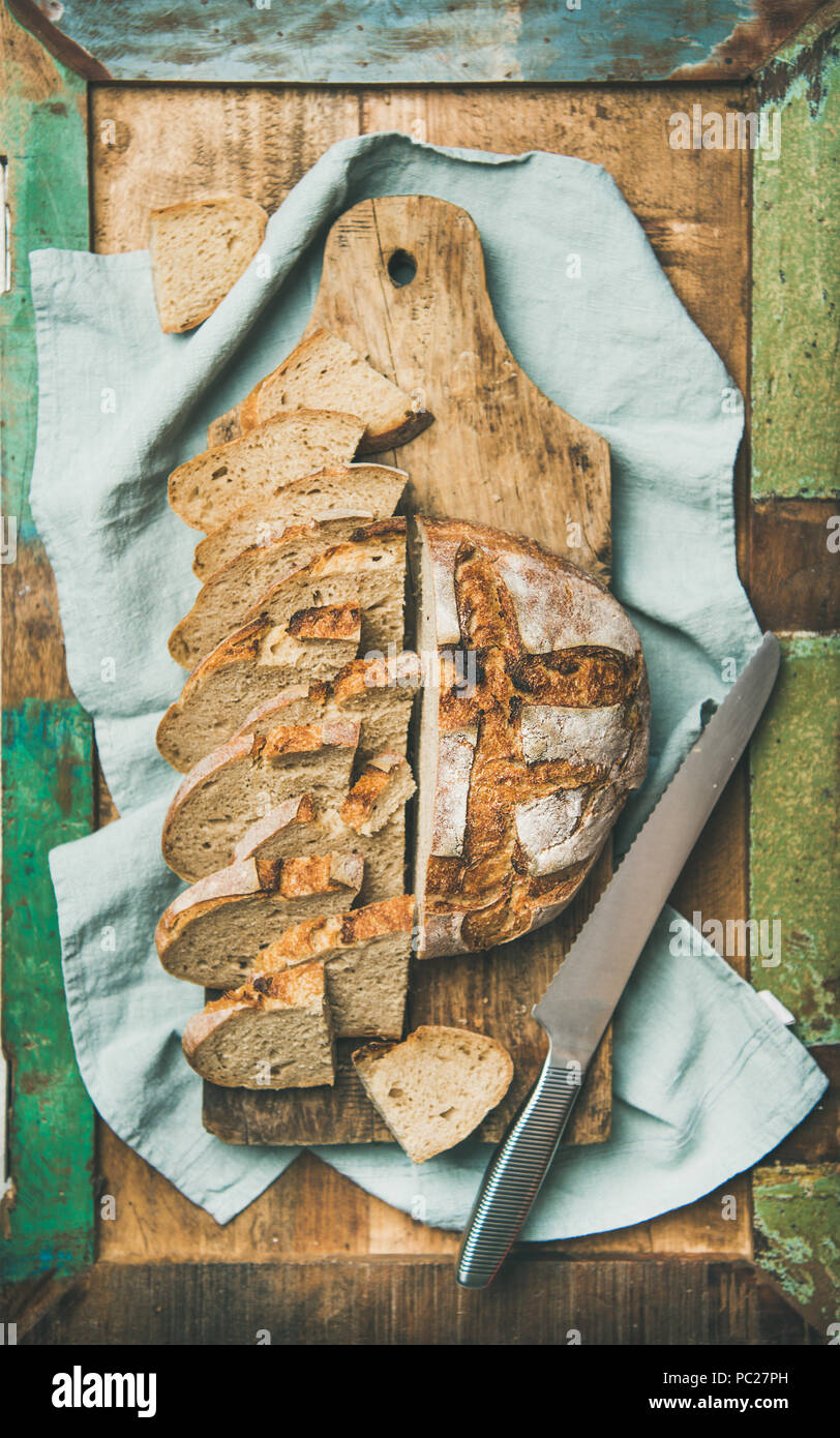 Flat-lay of sourdough wheat bread cut in slices in tray Stock Photo - Alamy
