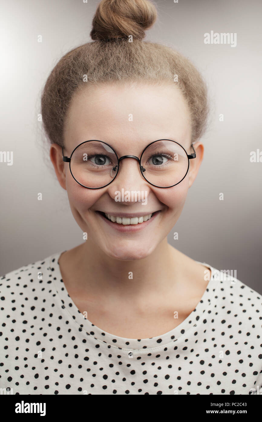 joyful young student in t-shirt. girl is pleased with something ...