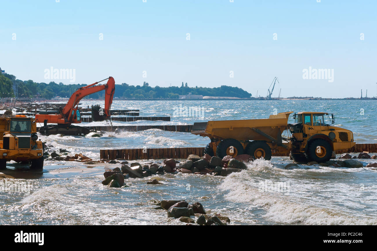 construction equipment on the shore, the construction of breakwaters ...