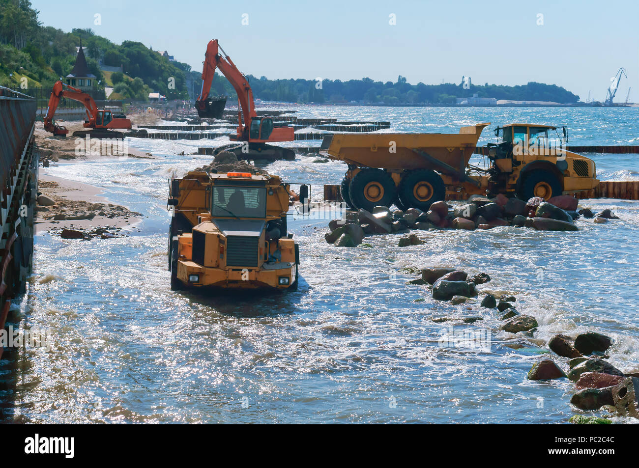 construction equipment on the shore, the construction of breakwaters ...