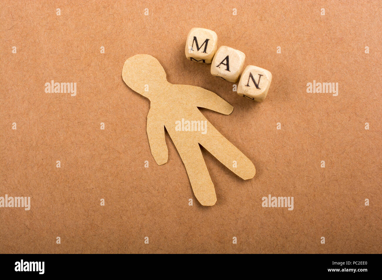 Paper man and man wording with letter cubes on paper Stock Photo - Alamy