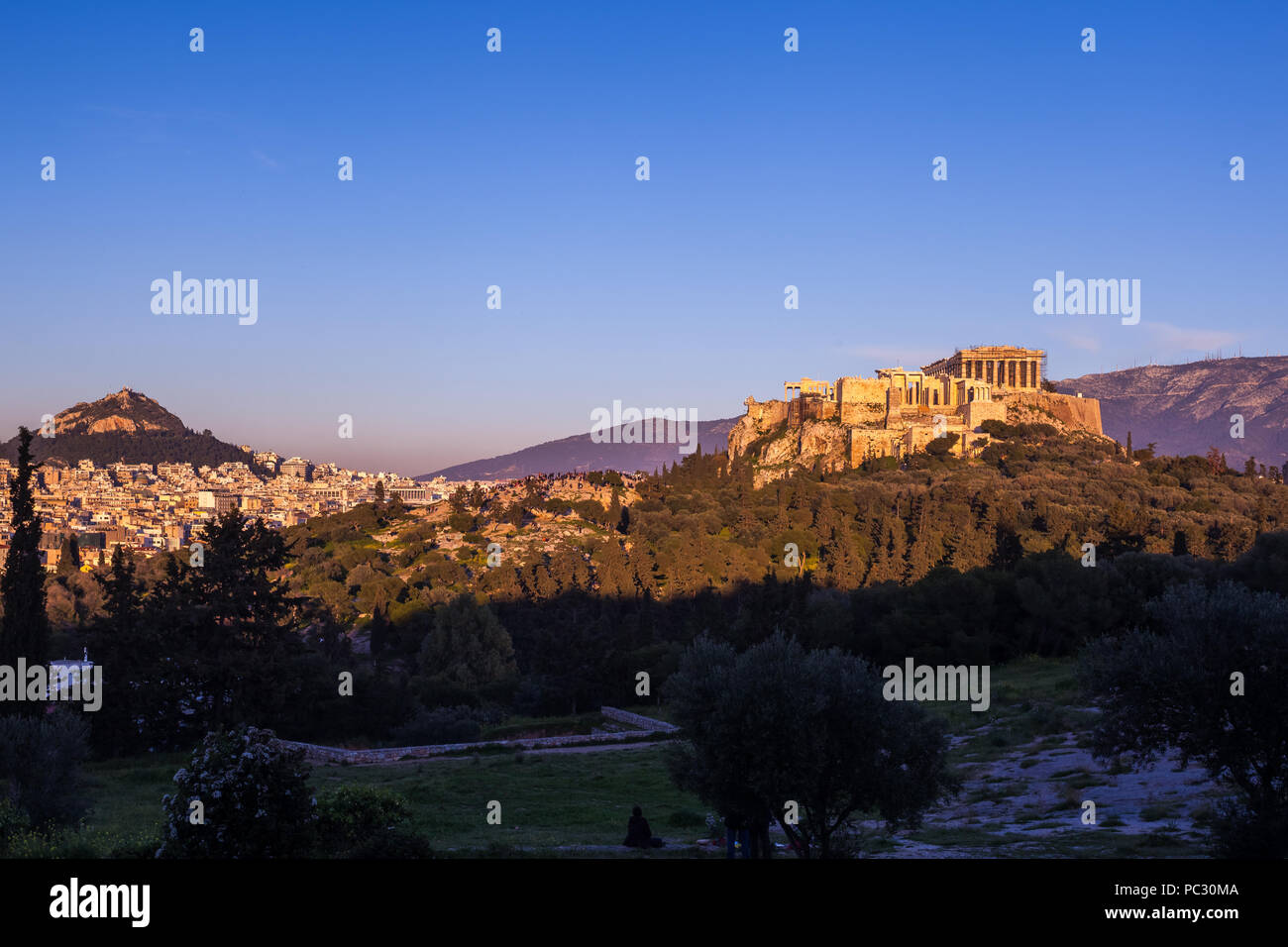 The Parthenon Temple at the Acropolis of Athens during colorful sunset ...