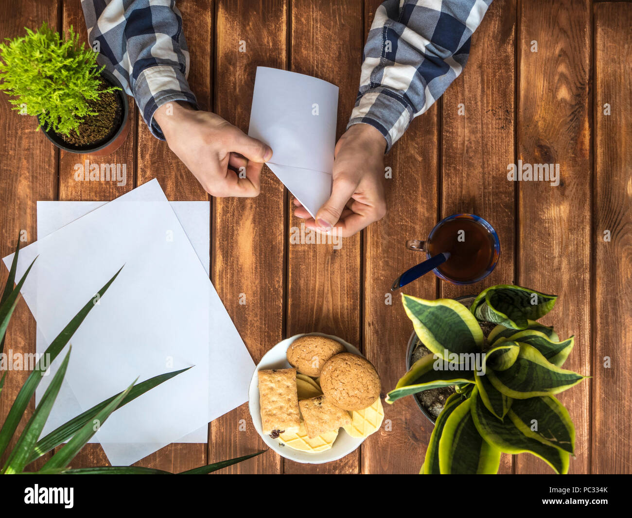 Child doing origami hi-res stock photography and images - Alamy