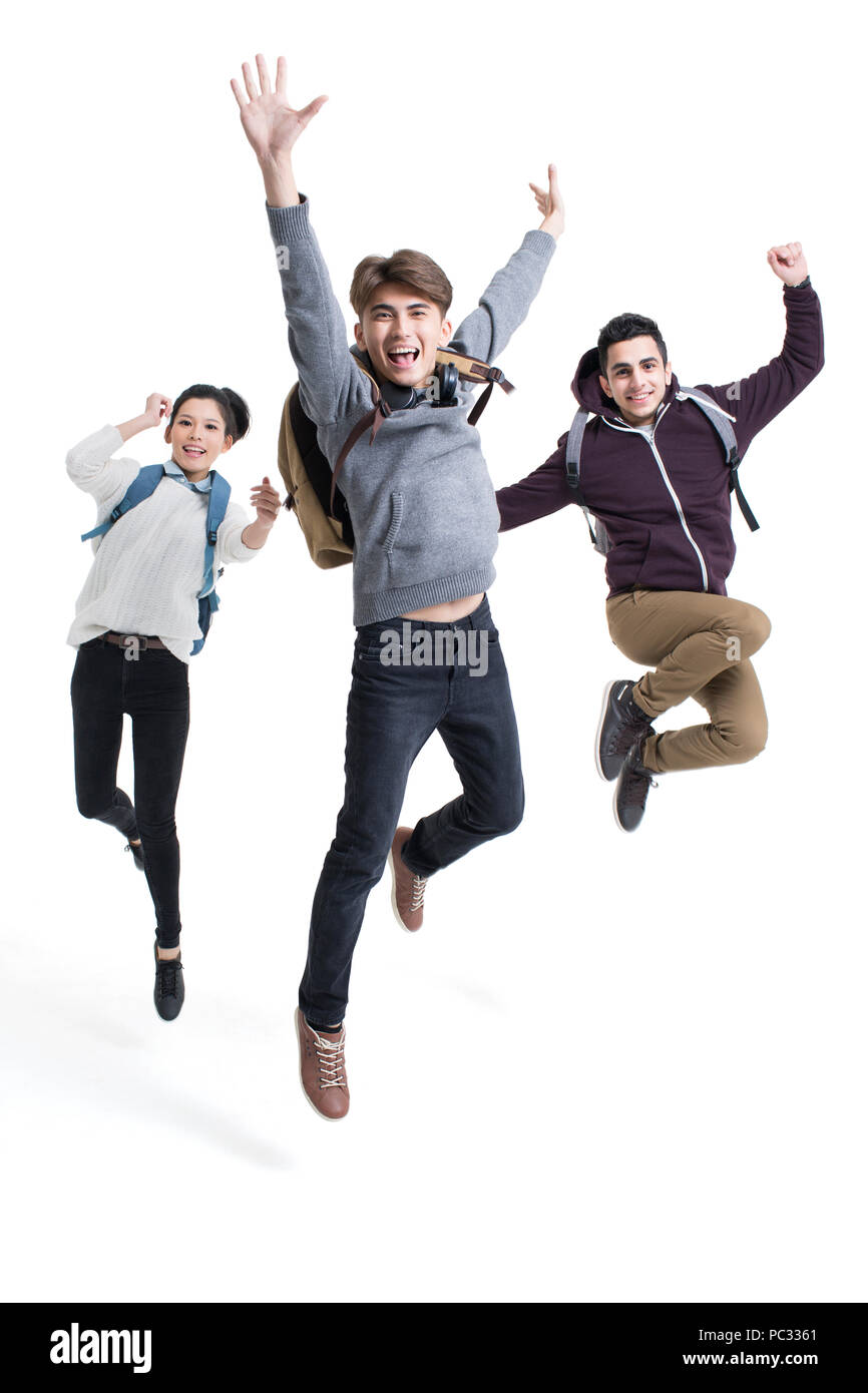 Cheerful abroad students jumping Stock Photo - Alamy