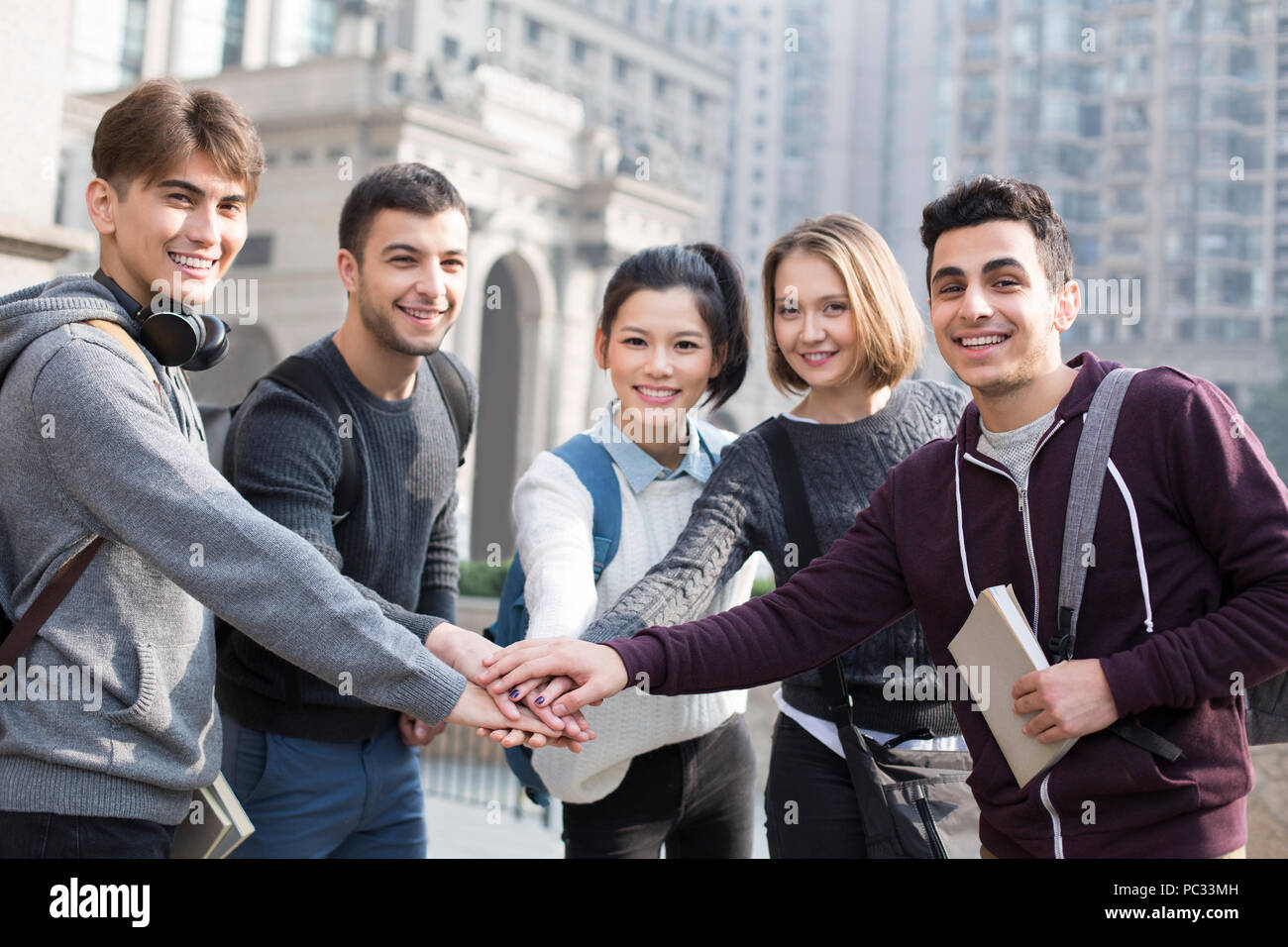 Cheerful abroad students on campus Stock Photo - Alamy