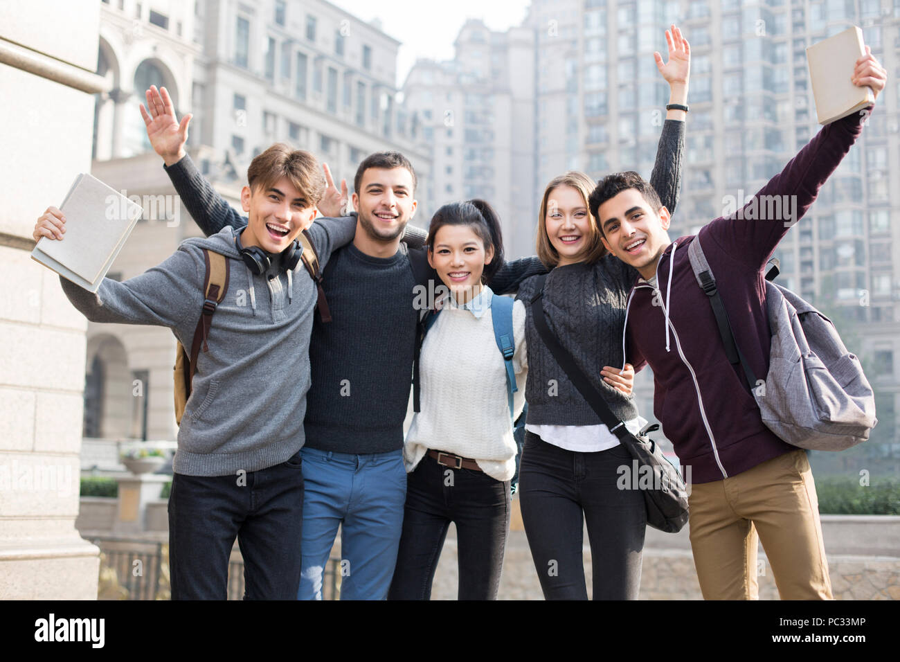 Students waving hand hi-res stock photography and images - Alamy