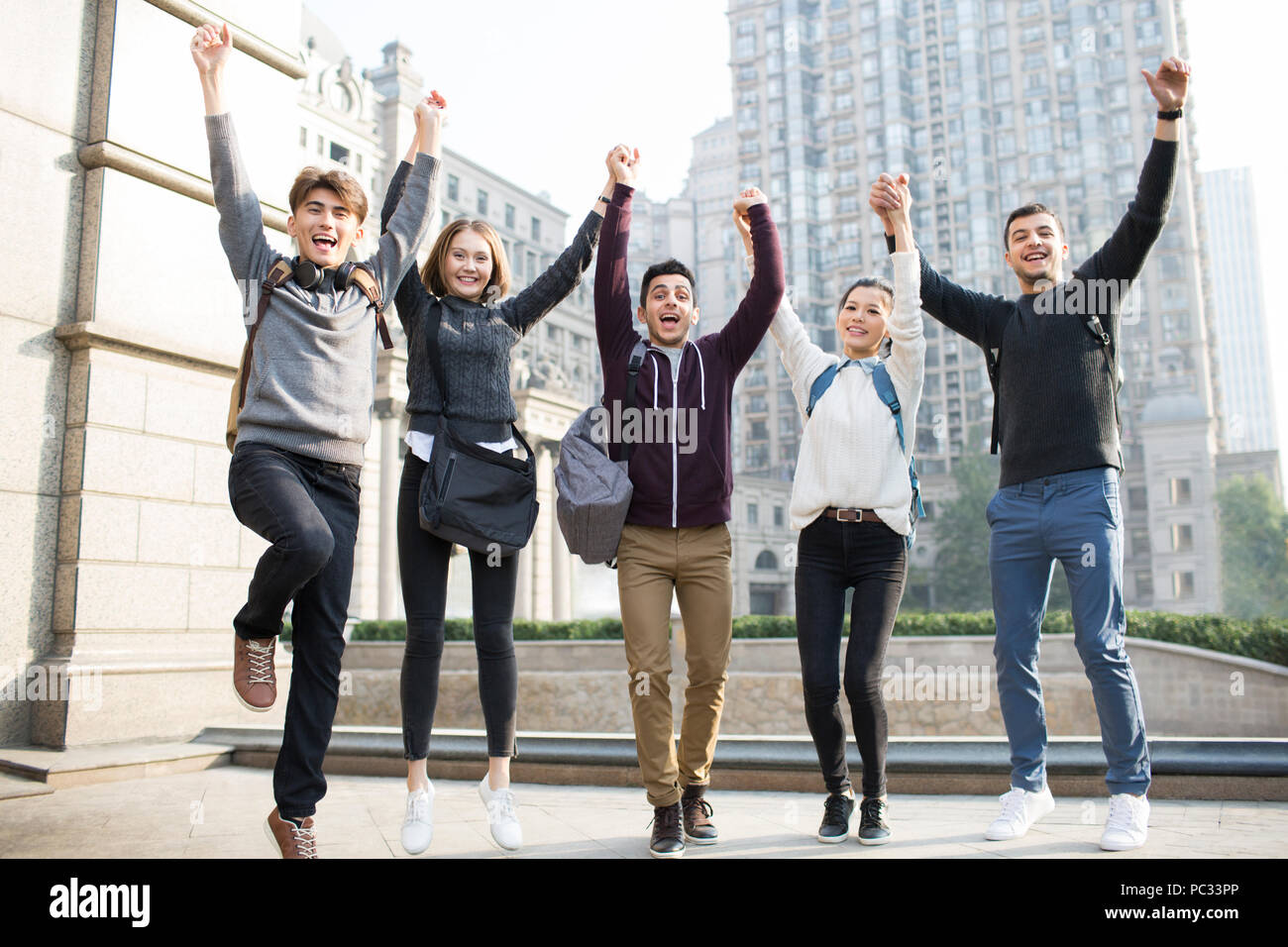 Group students jumping in school hi-res stock photography and images ...